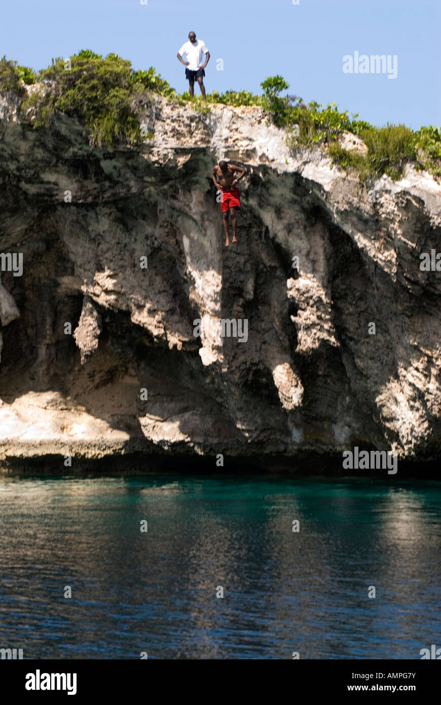 Man jumping from cliff at Dean's Blue Hole, Long Island, Bahamas Stock ...