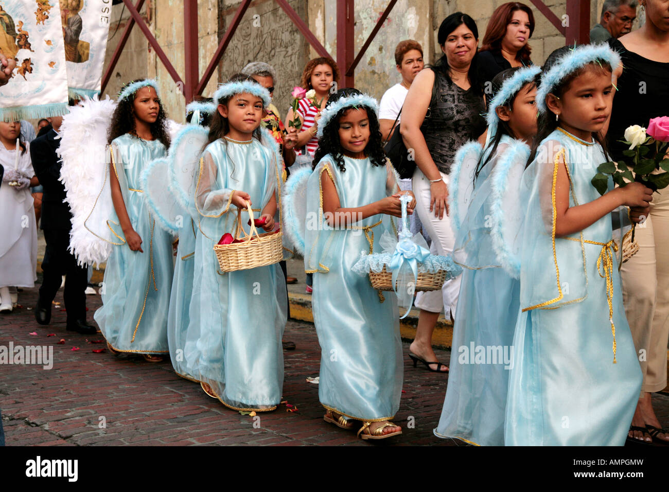Young girls dressed as angels during a religious parade procession at ...