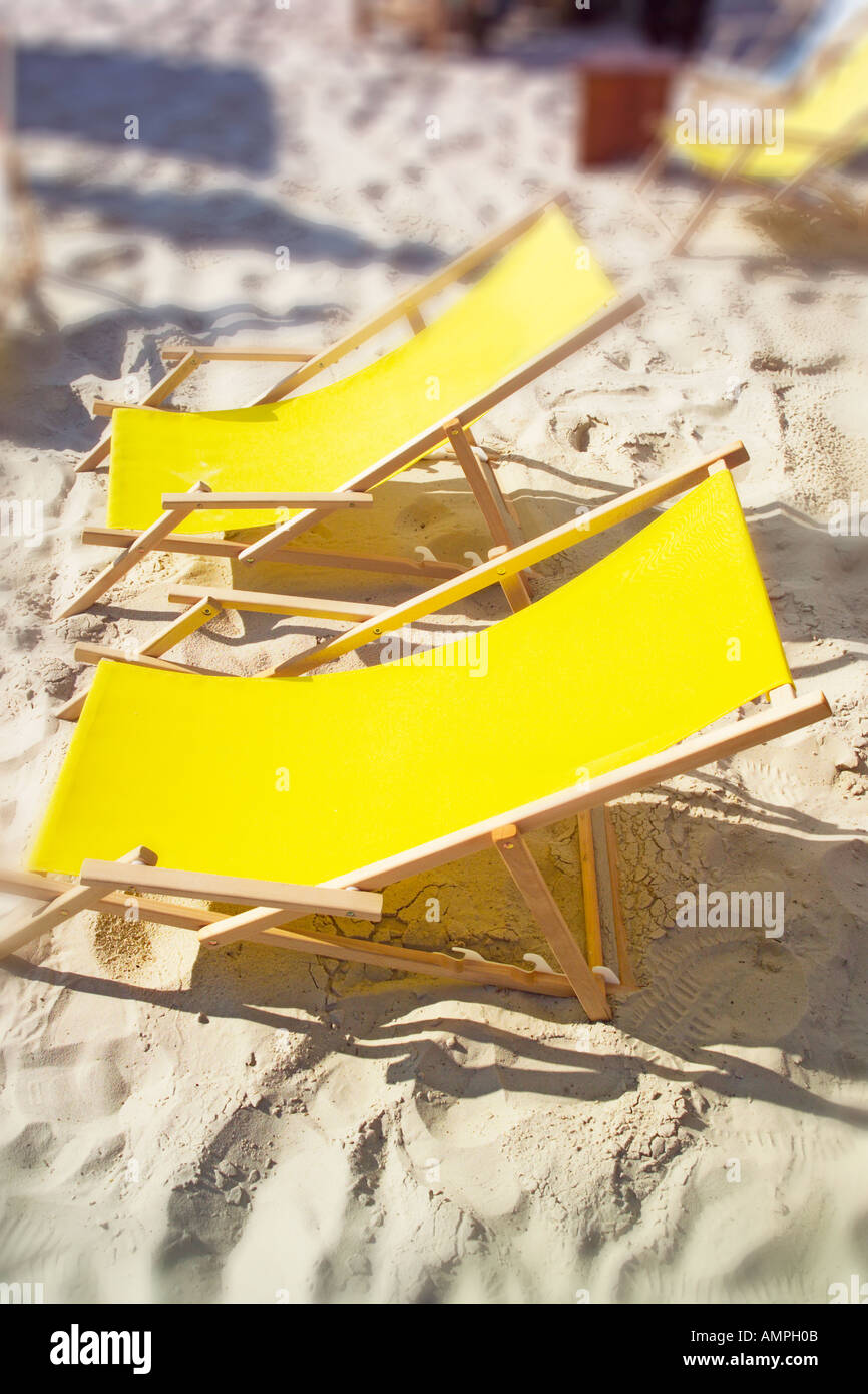 Two yellow deck-chairs Stock Photo - Alamy