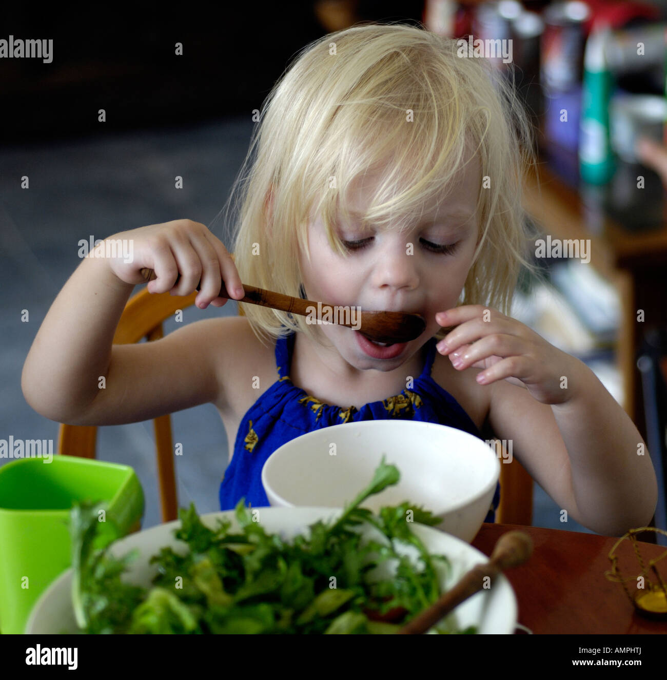 Baby eating by herself hi-res stock photography and images - Alamy