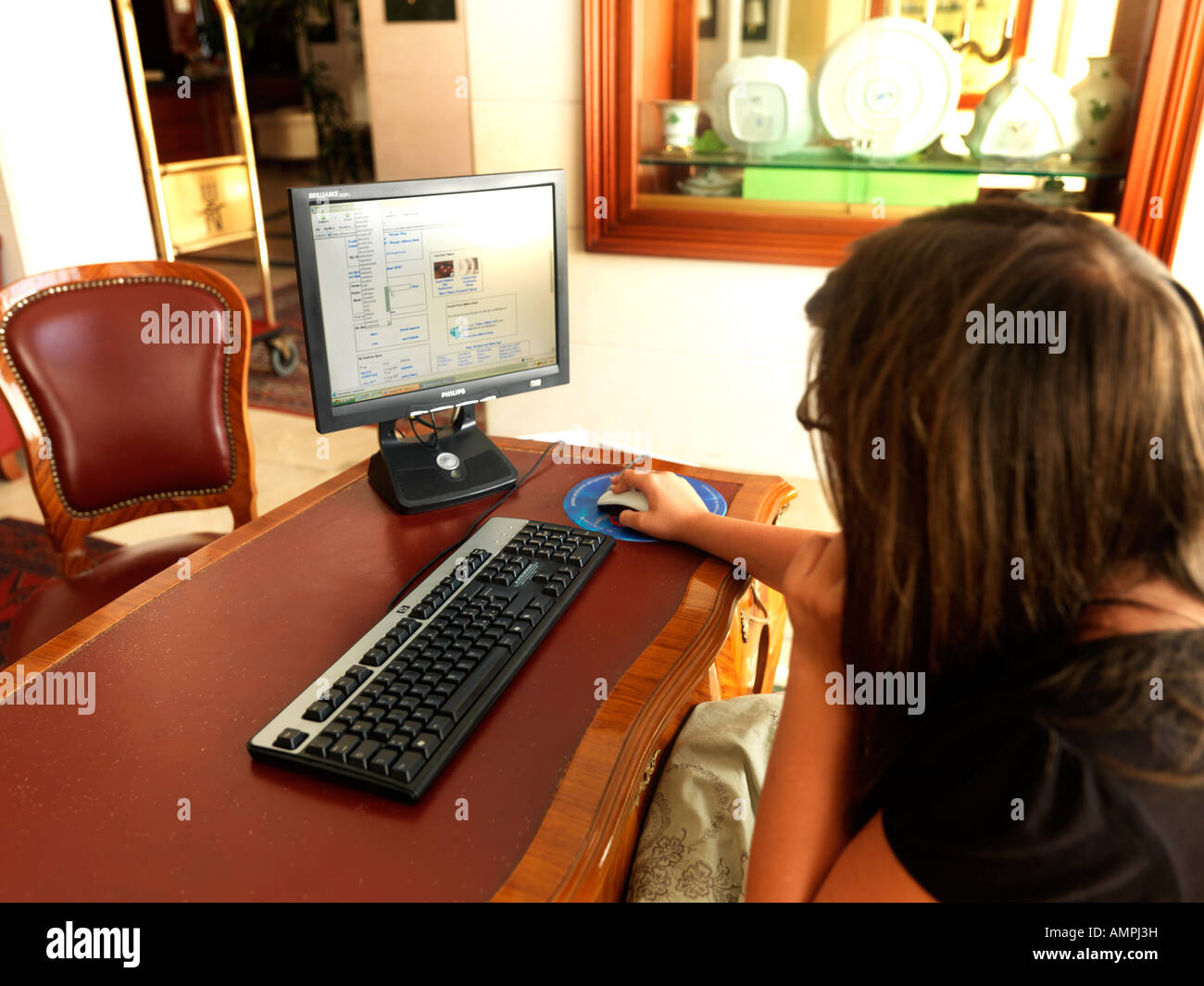 Teenager Using Computer in Hotel Lobby Catania Sicily Stock Photo - Alamy