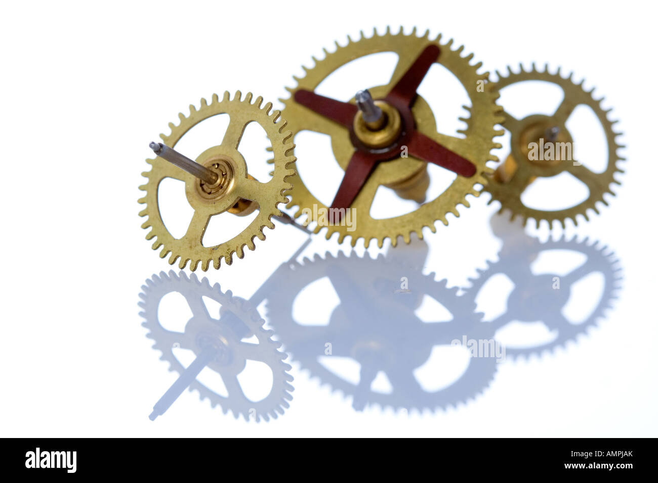 Three cog wheels and their reflection Stock Photo - Alamy