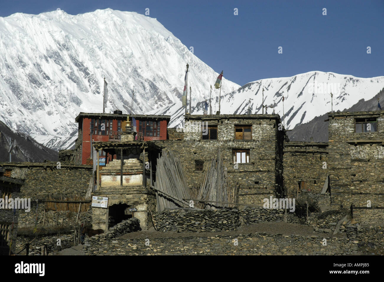 Unique gate to village Khangsar with stone houses and ice capped ...