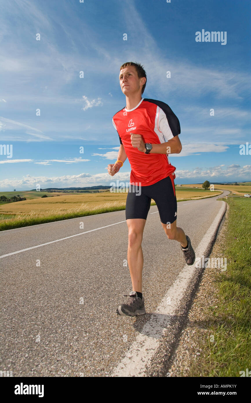 jogger running on street Stock Photo - Alamy
