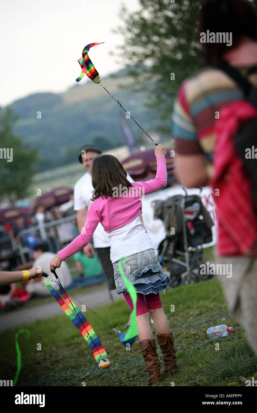 Children playing with ribbons at festival Stock Photo - Alamy