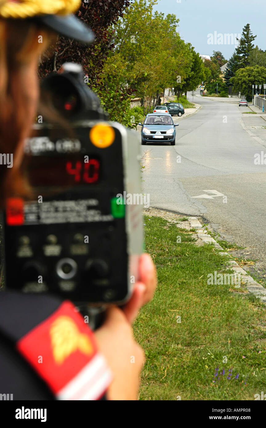 A Police Officer measuring speed with a Laser Gun Stock Photo - Alamy