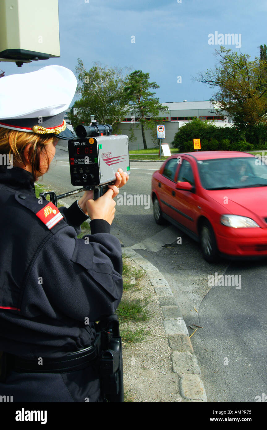 A Police Officer measuring speed with a Laser Gun Stock Photo - Alamy