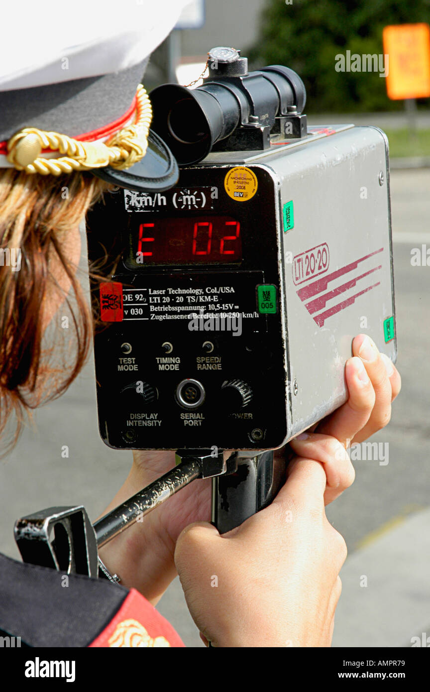A Police Officer geting an measuring speed error with a Laser Gun Stock ...