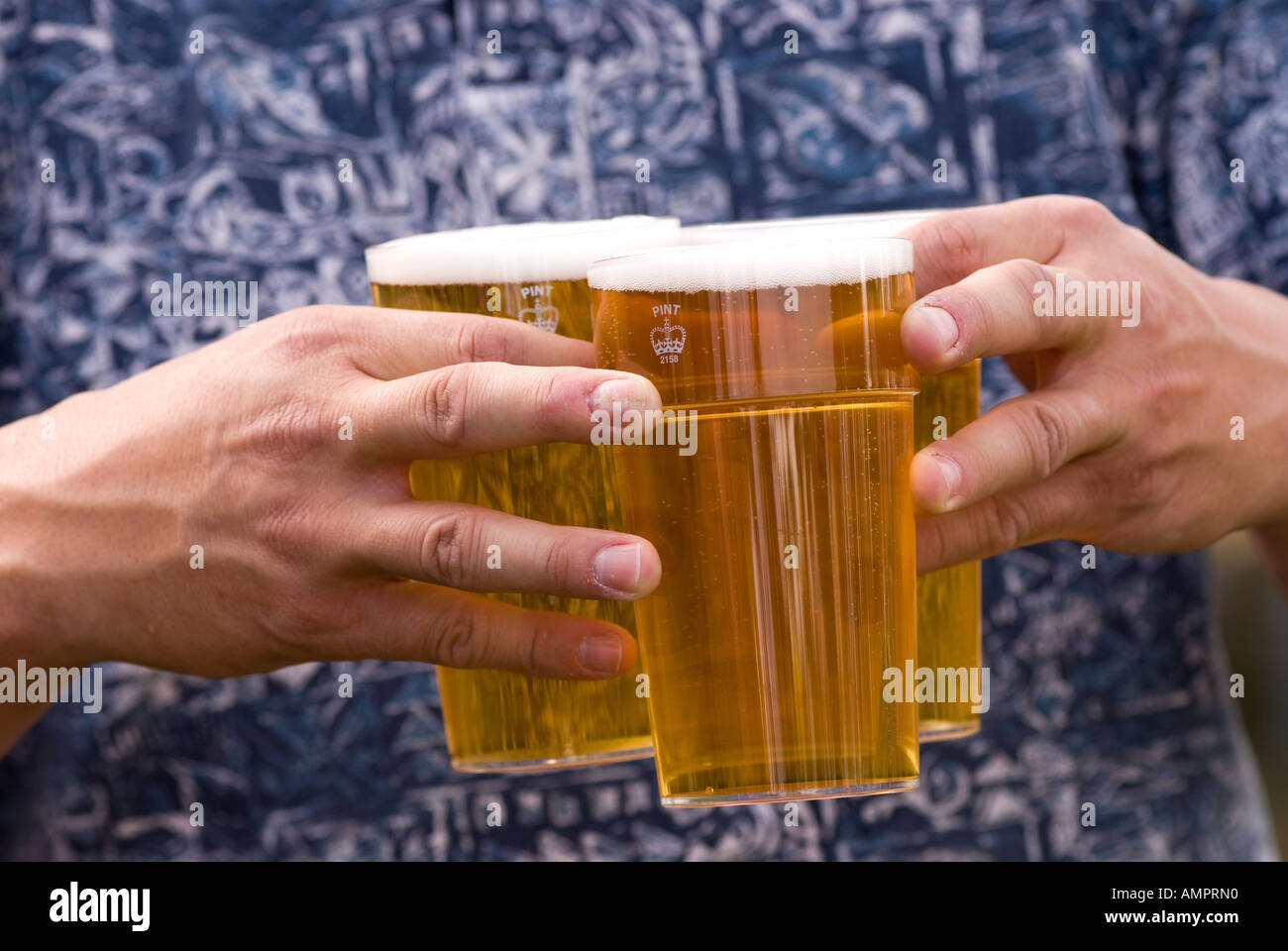 Man holding pints hi-res stock photography and images - Alamy