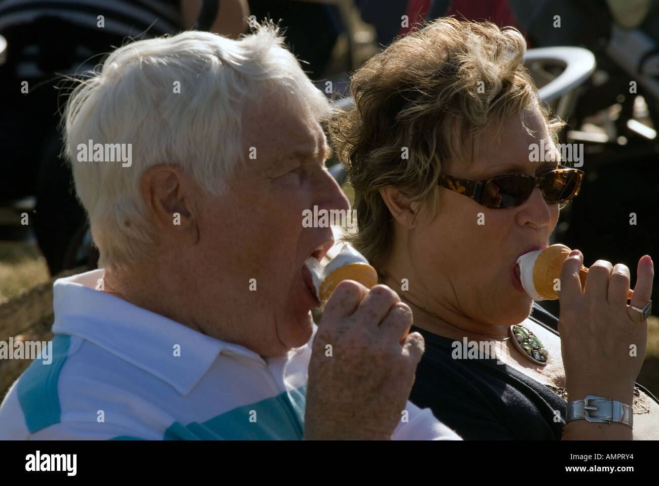 Couple eating ice cream at Hampton Court Show 2006 Stock Photo - Alamy