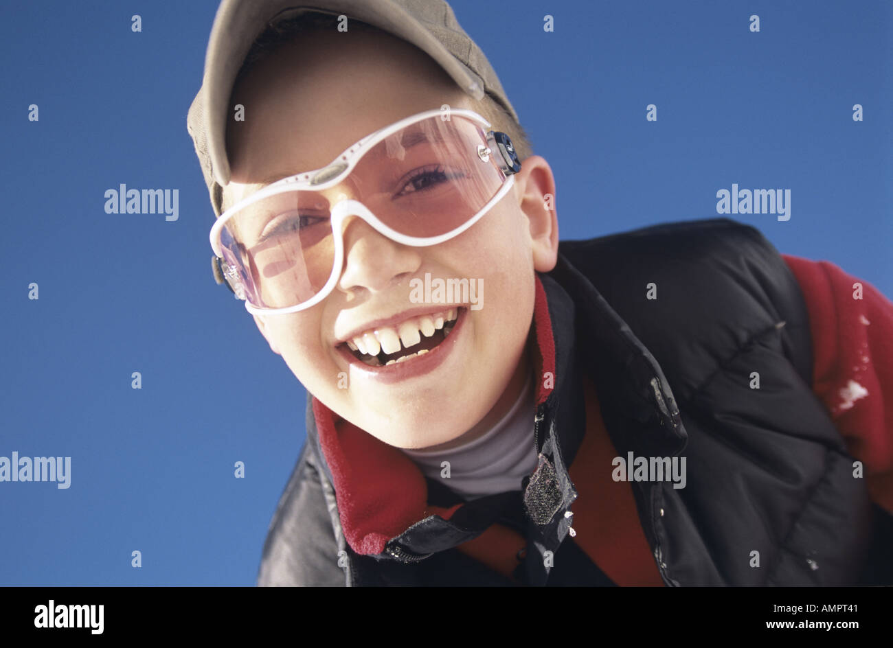 Boy smiling, low angle view Stock Photo - Alamy