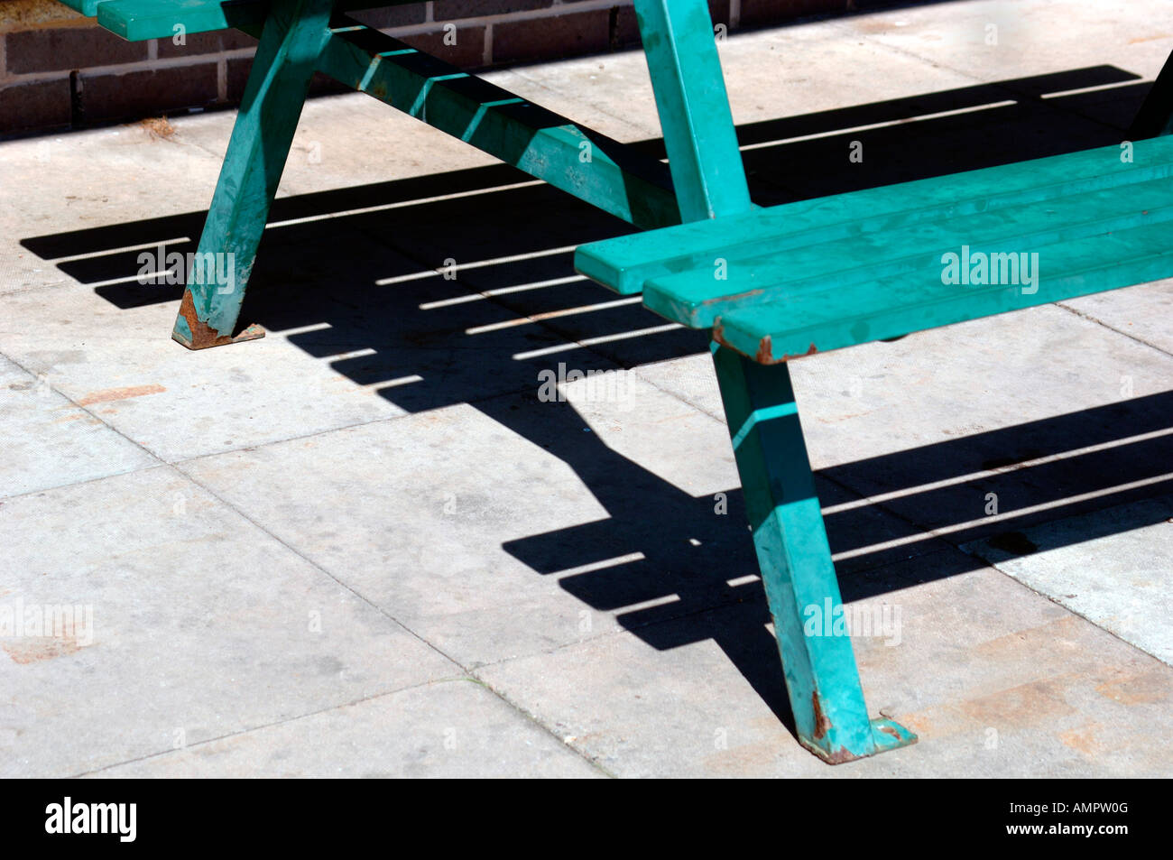 Green Metal Picnic Table,Casting Shadows On The Ground Stock Photo - Alamy