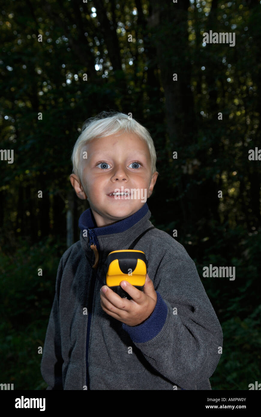 A three year old boy holding a handheld GPS device Stock Photo - Alamy