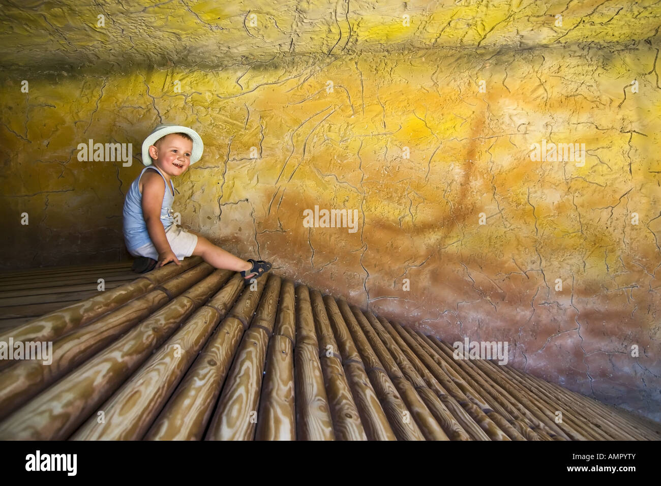 kids play in cave on playground Stock Photo - Alamy