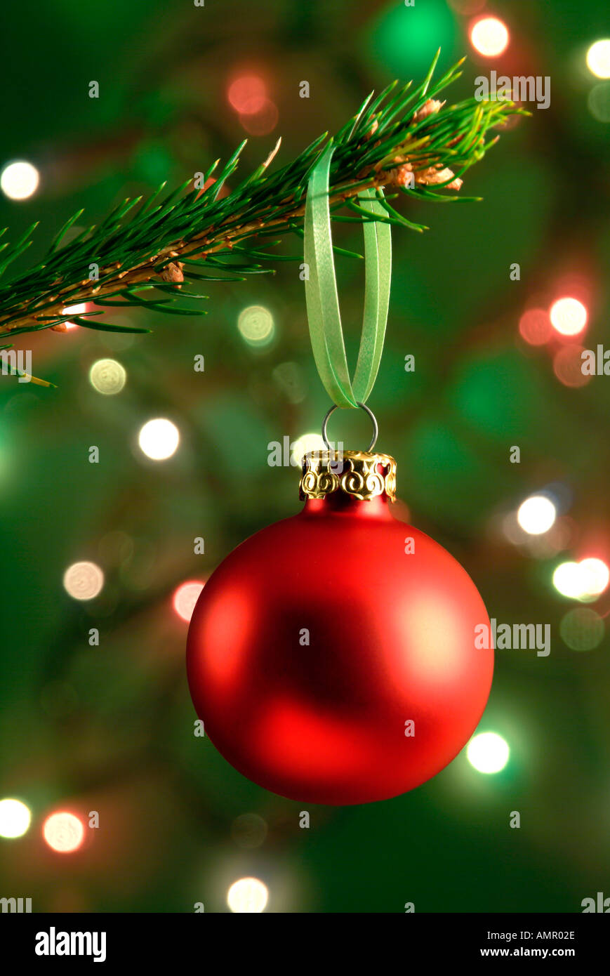 Red bauble on a Christmas tree Stock Photo - Alamy