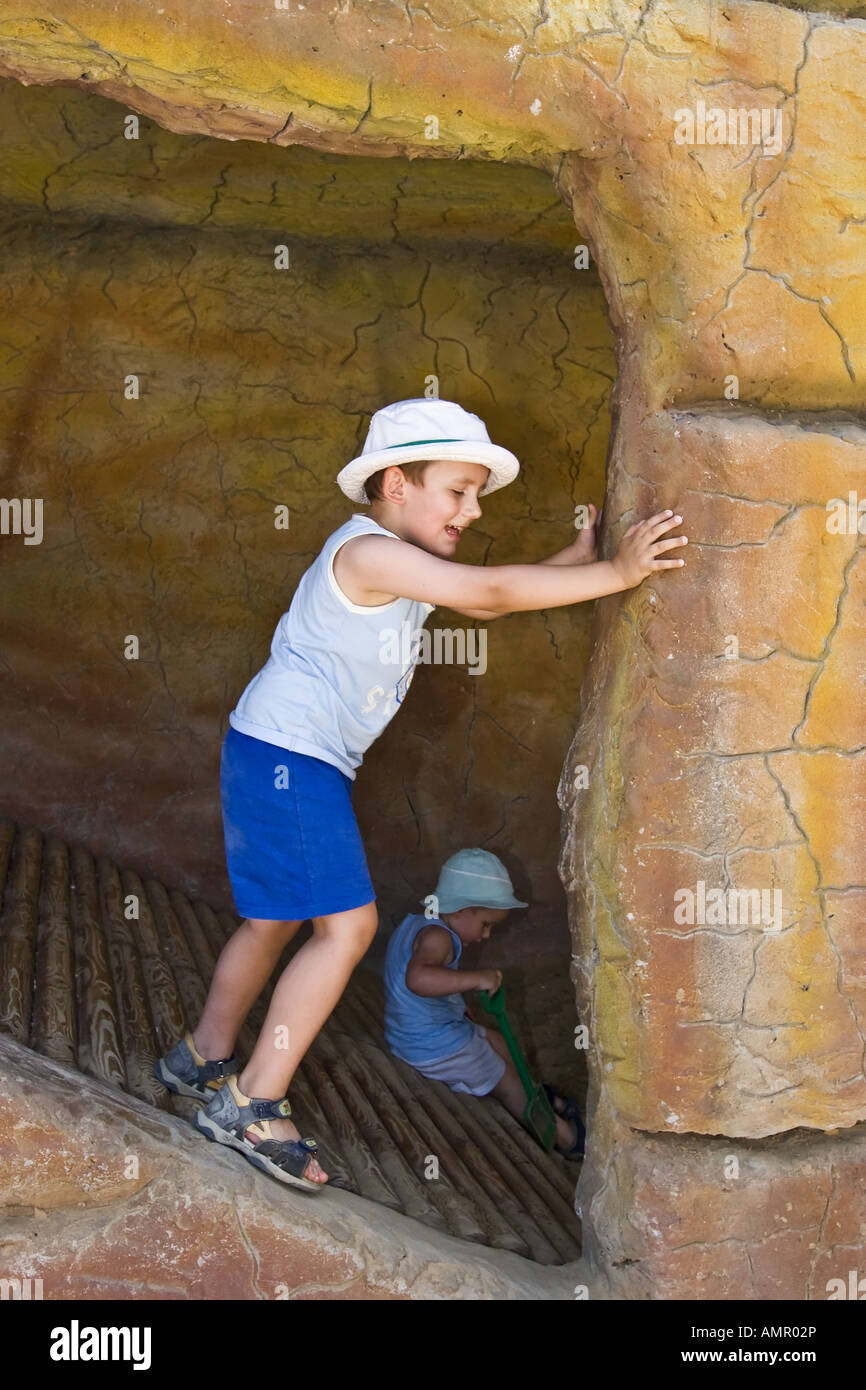 kids play in cave on playground Stock Photo - Alamy
