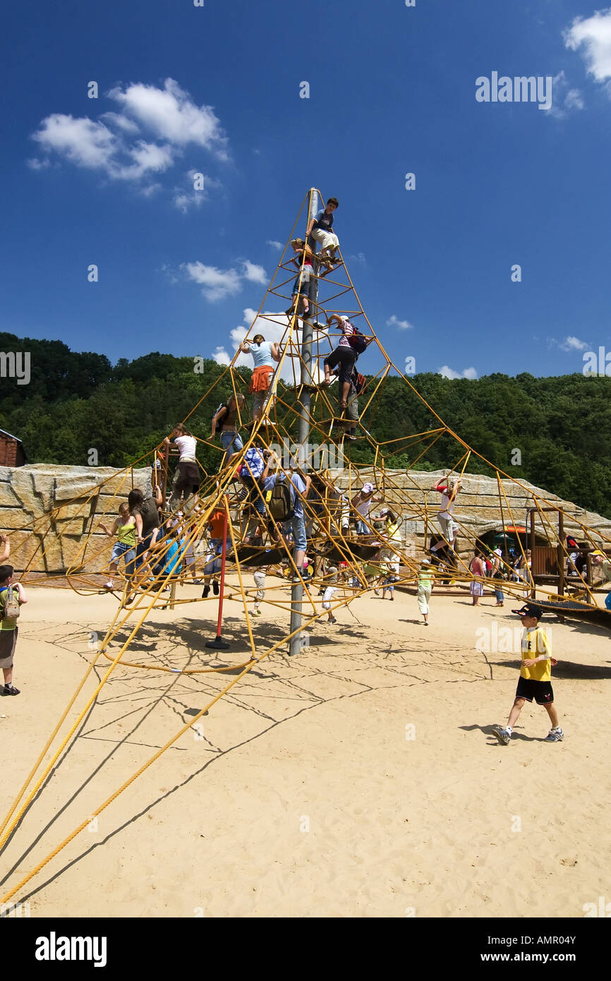 boys and girls playing on rope climbing frame Stock Photo - Alamy