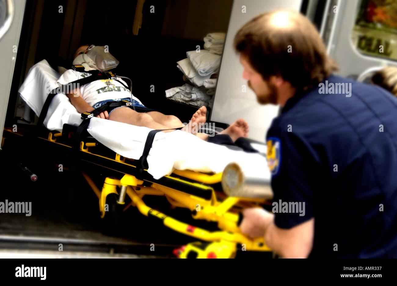 EMT loading patient into ambulance Stock Photo - Alamy