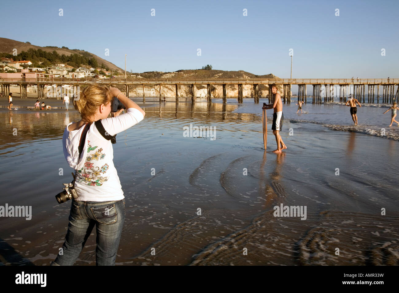 Photographer taking beach surfer shots Stock Photo - Alamy