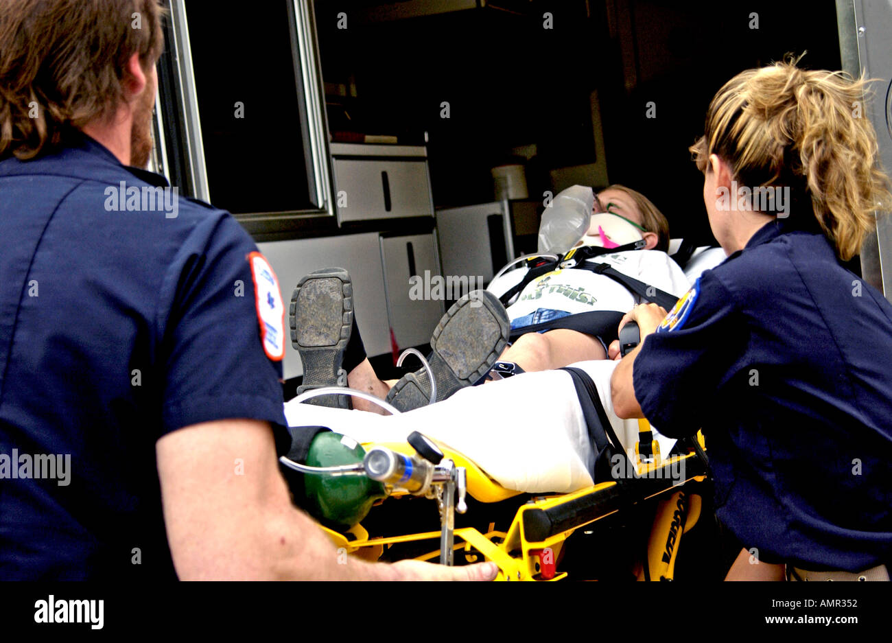 Emts loading patient ambulance hi-res stock photography and images - Alamy
