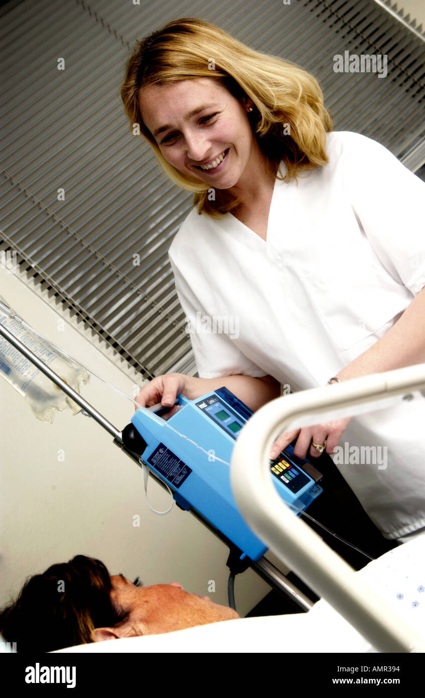 Nurse with patient setting up IV Stock Photo - Alamy