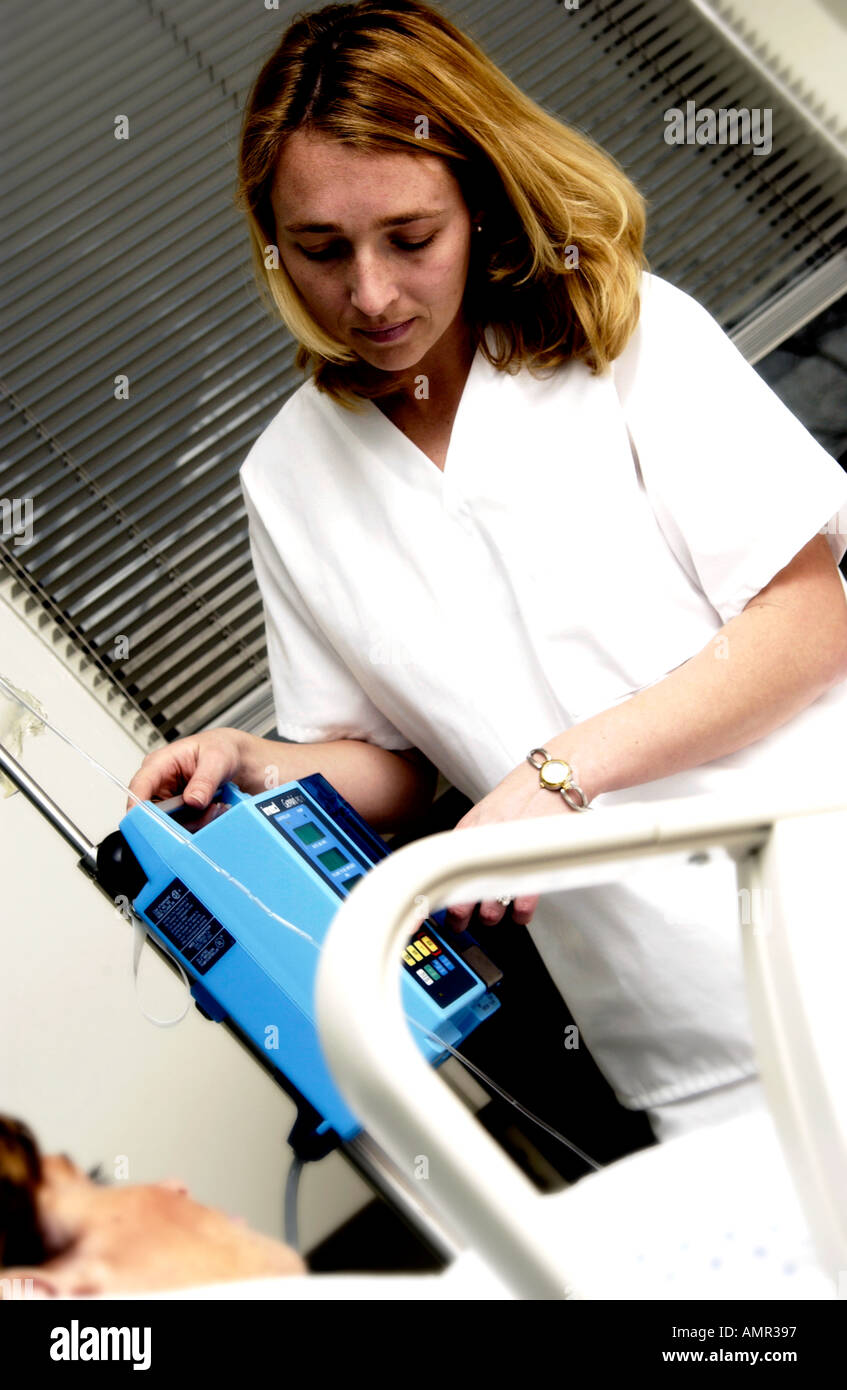 Nurse with patient setting up IV Stock Photo - Alamy