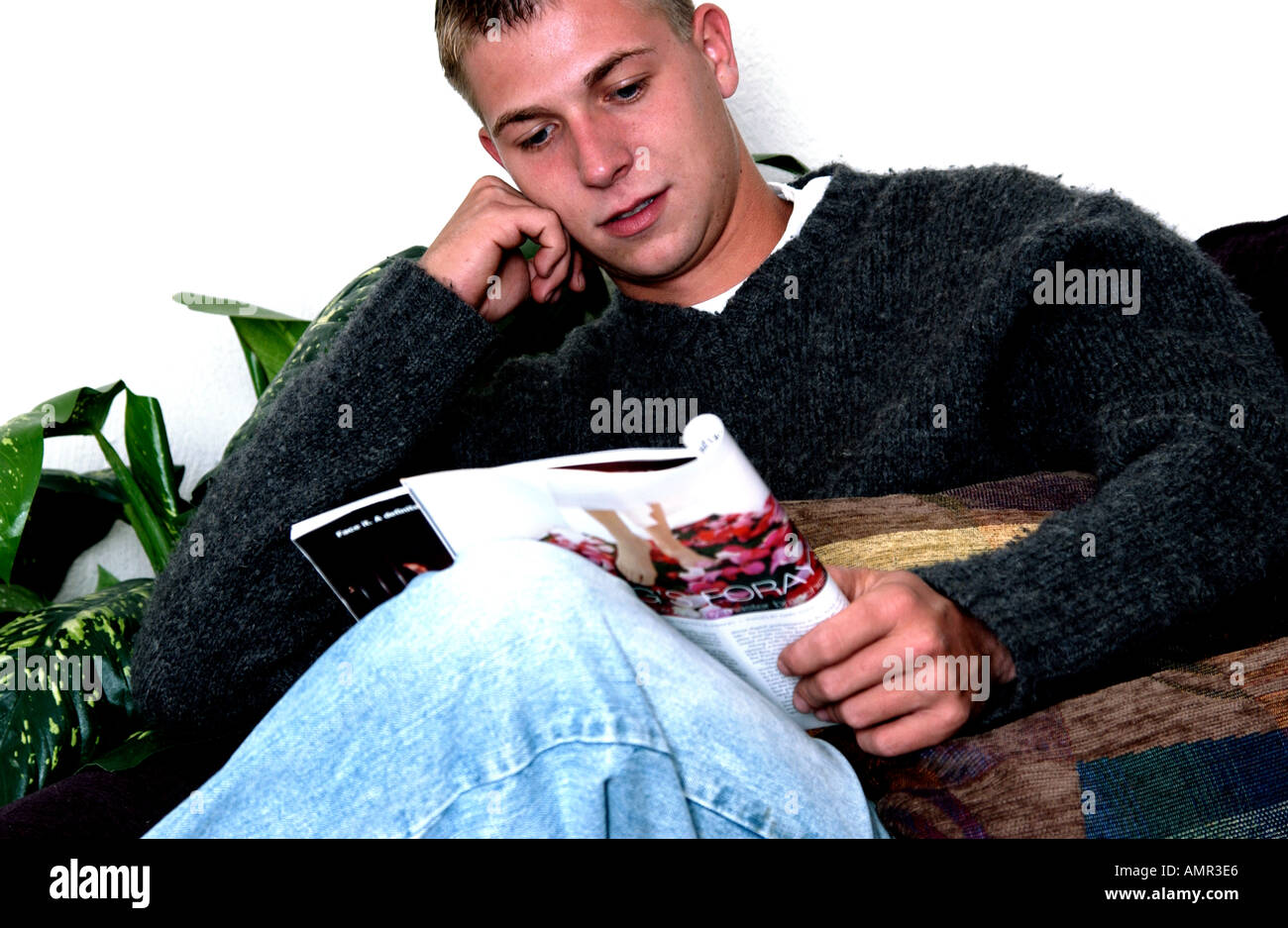 Man reading magazine Stock Photo - Alamy