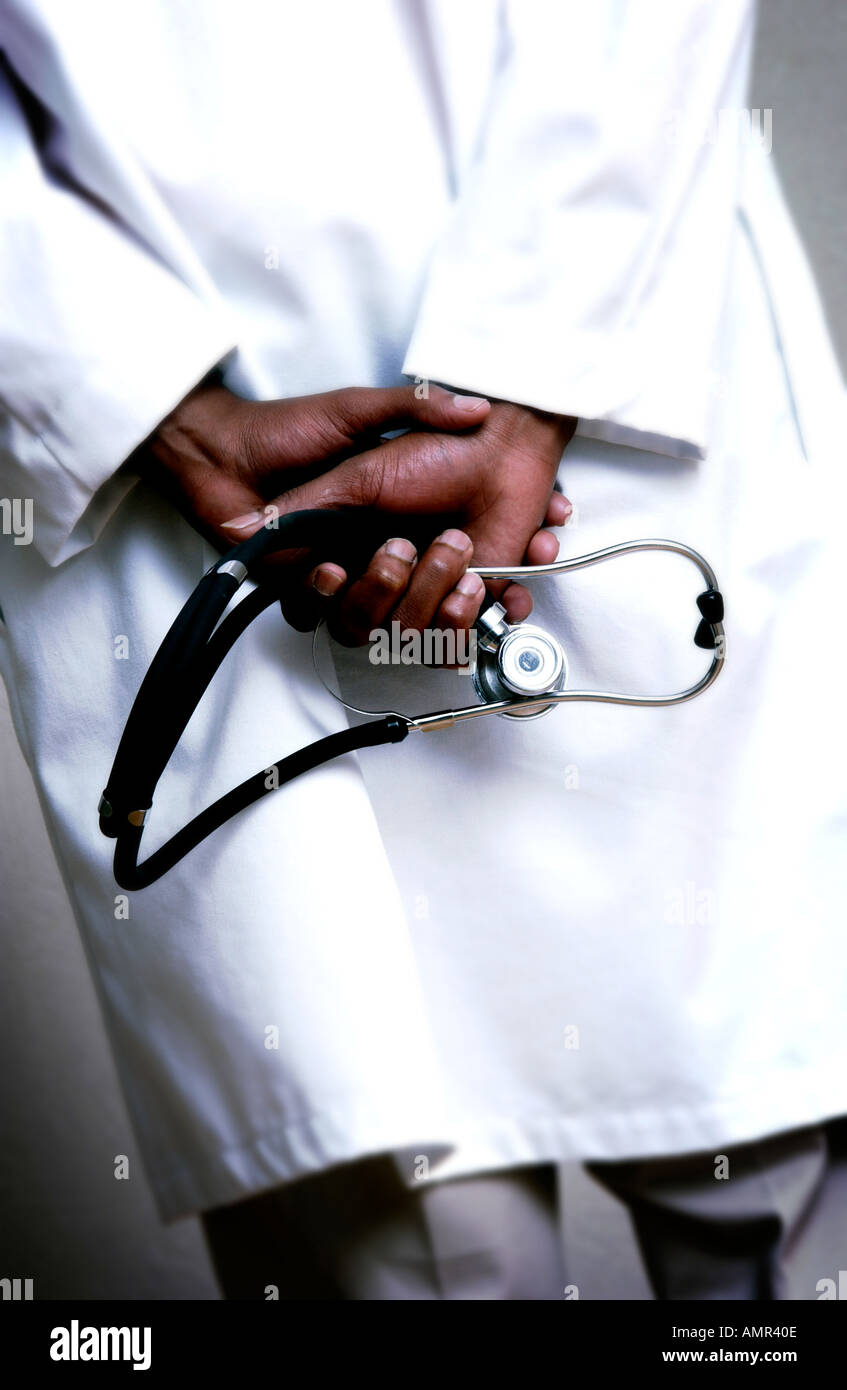 African American doctor holding stethoscope Stock Photo - Alamy