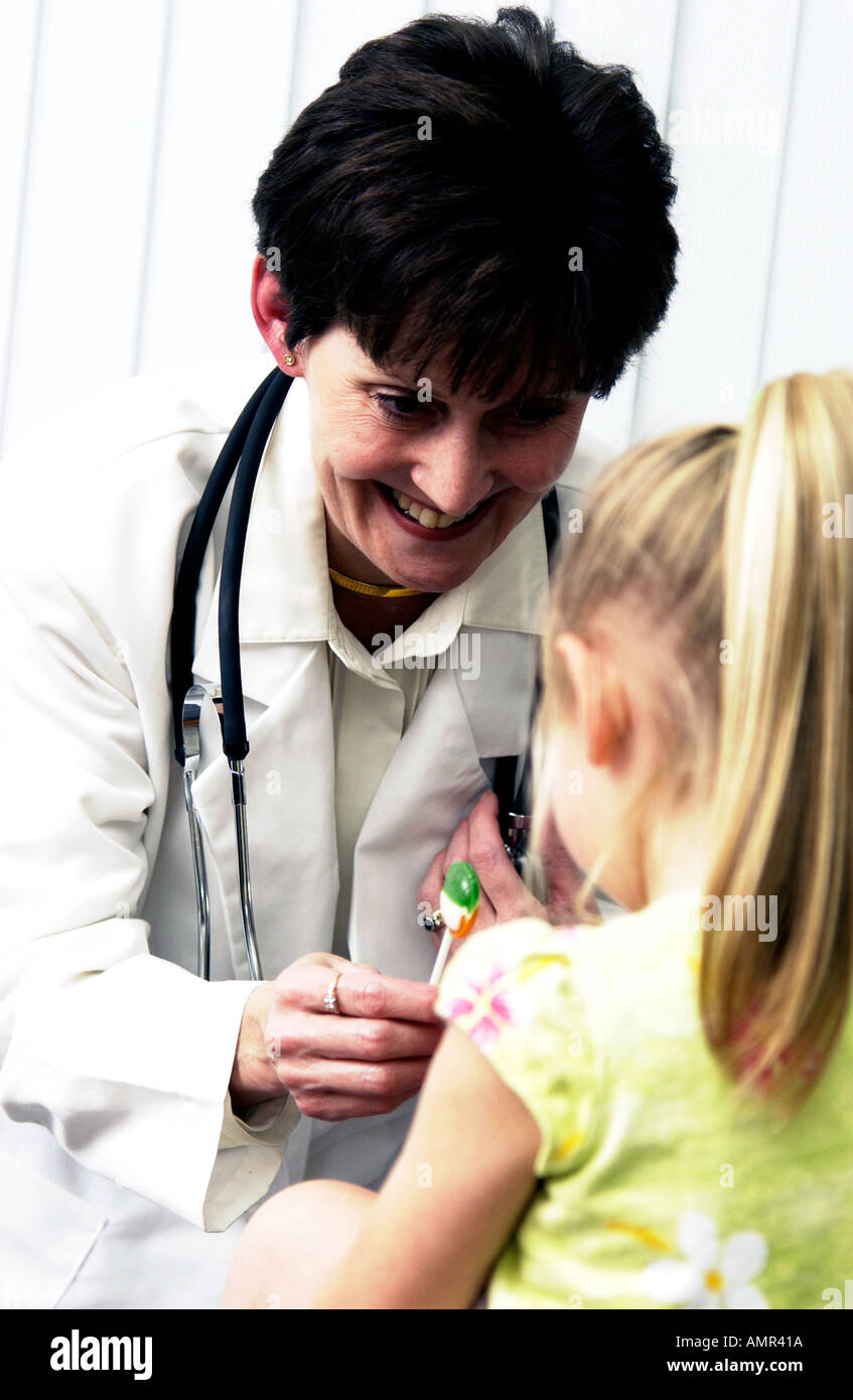 Doctor examining child Doctor examining child Stock Photo - Alamy