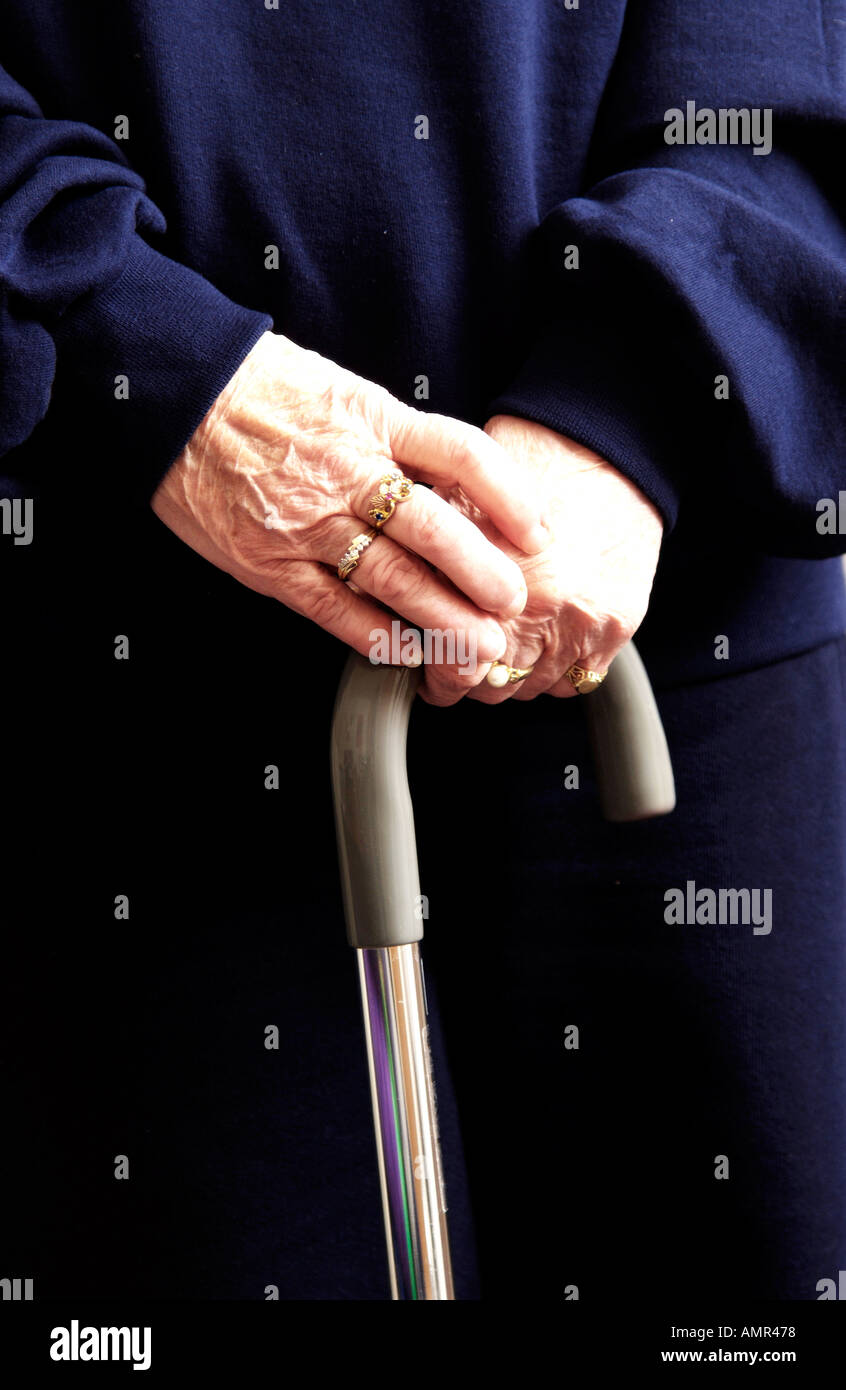 Womans hands on cane Stock Photo - Alamy