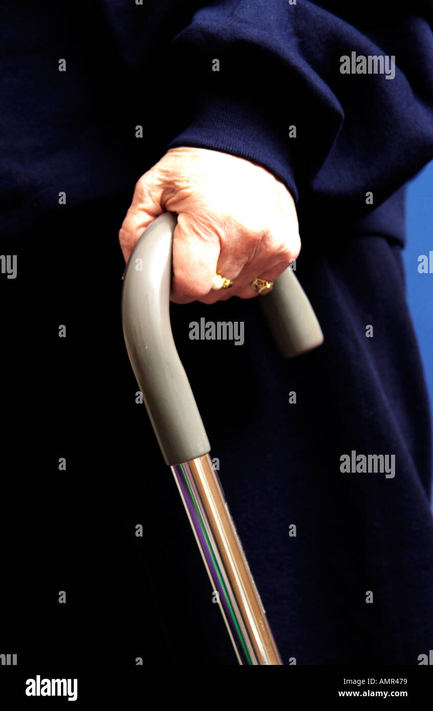 Womans hands on cane Stock Photo - Alamy