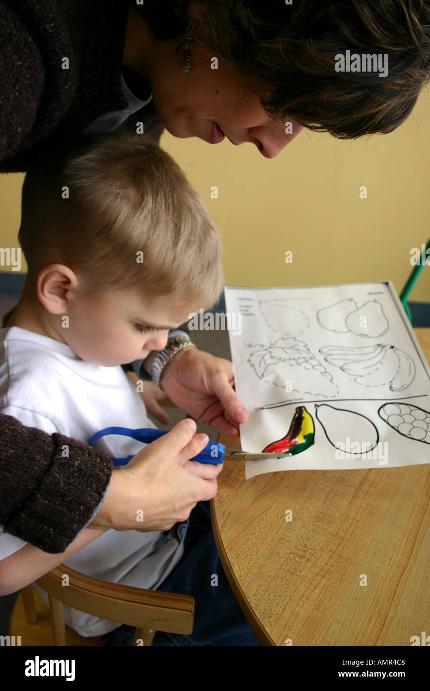 Boy gluing paper hi-res stock photography and images - Alamy