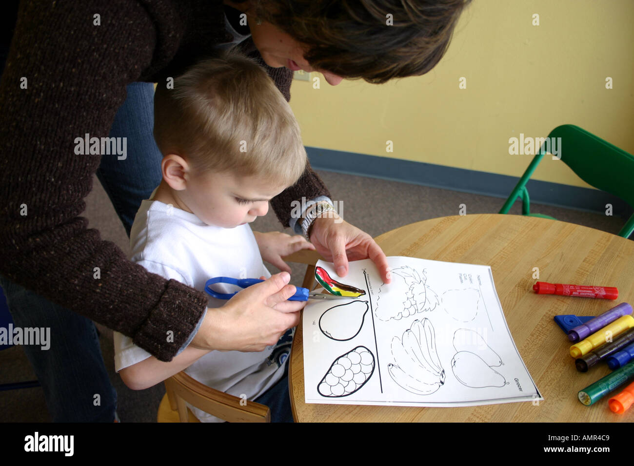 Boy gluing paper hi-res stock photography and images - Alamy