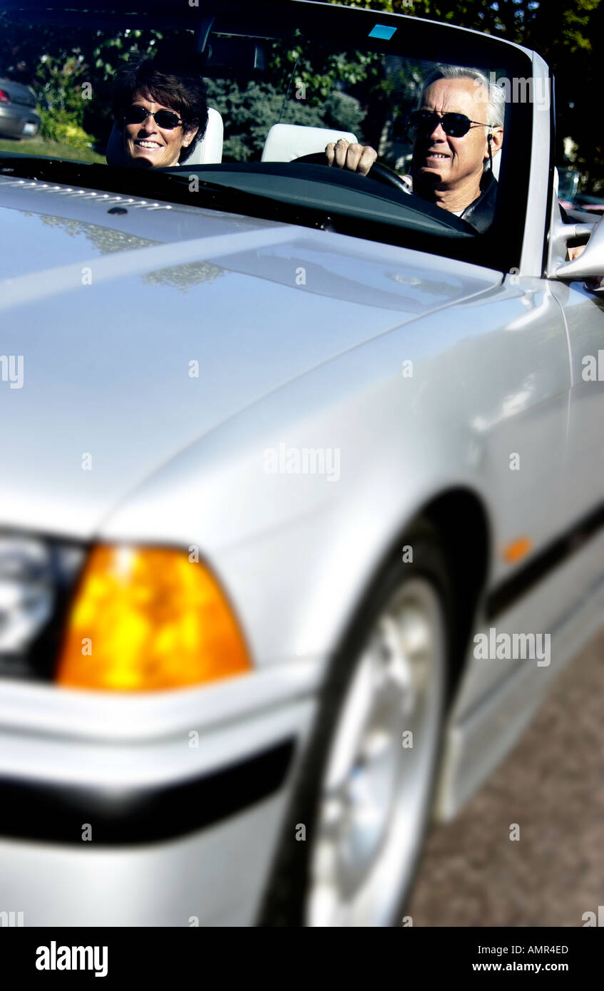 Couple in convertible Stock Photo - Alamy