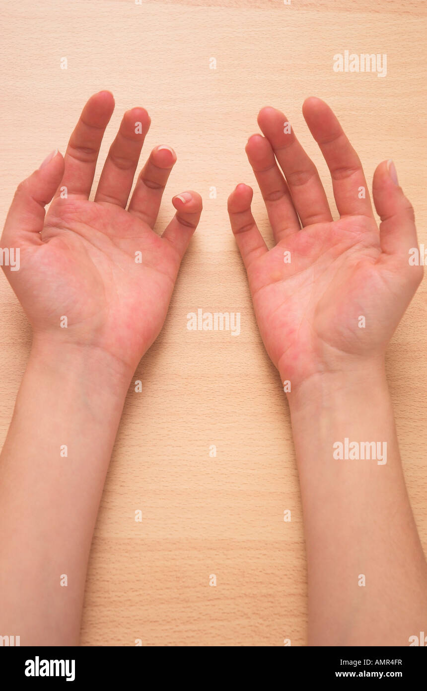 Womans hands on table Stock Photo - Alamy