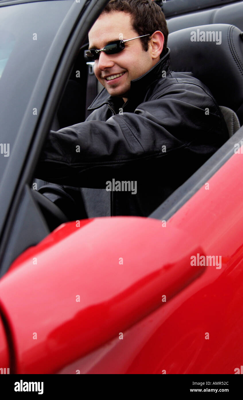 Man driving convertible Stock Photo - Alamy