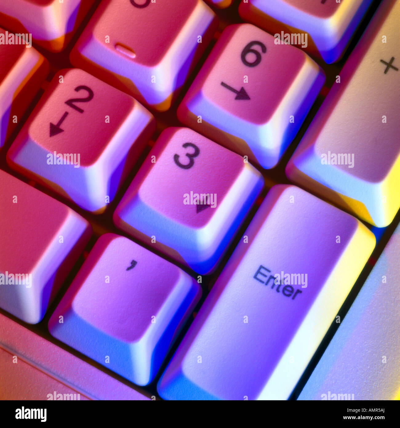 Close-up of a computer keyboard in colored light Stock Photo - Alamy