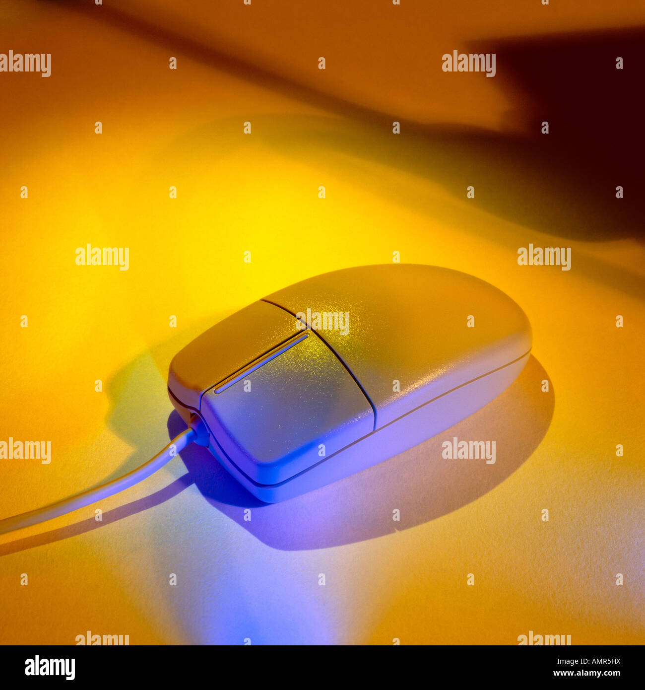 Computer mouse in coloured light Stock Photo - Alamy