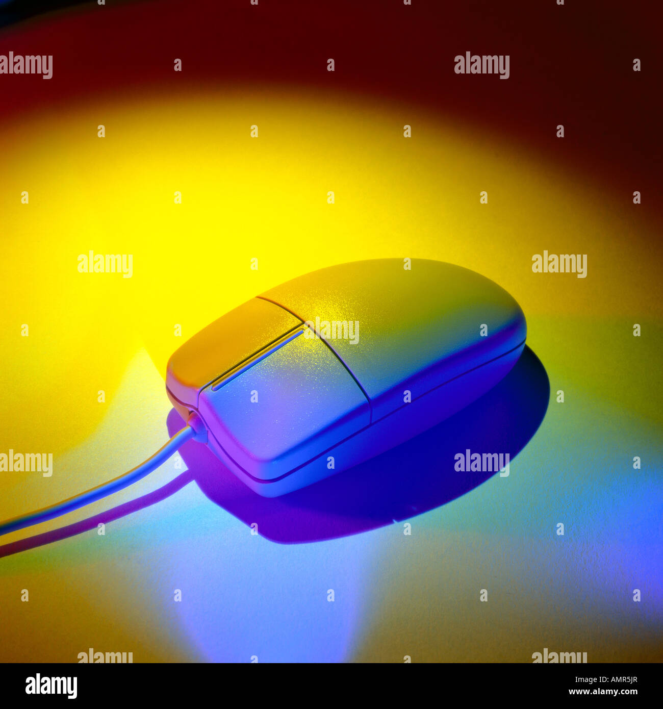 Computer mouse in coloured light Stock Photo - Alamy