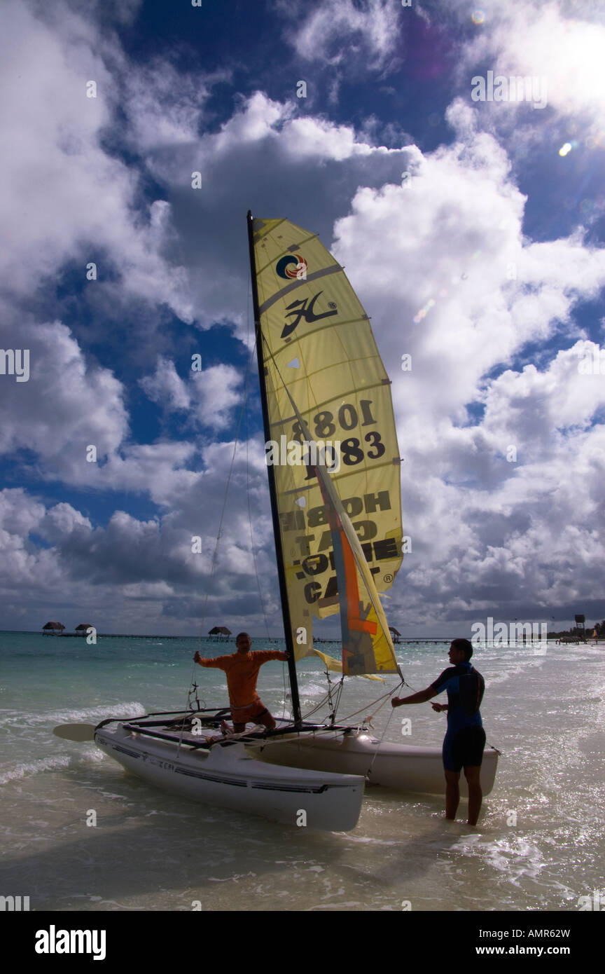 Hoby cat sail boat on Cuban island beach Stock Photo - Alamy