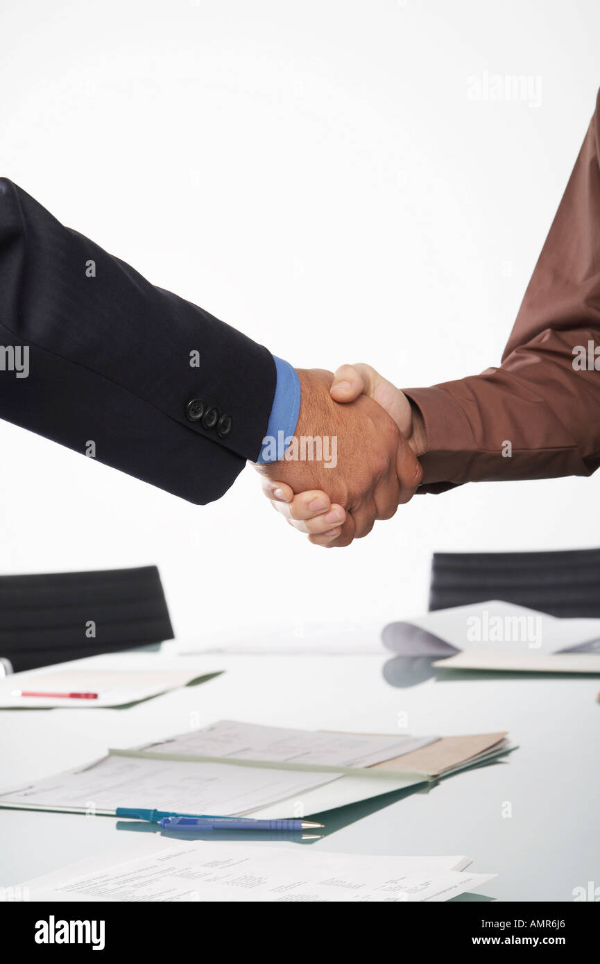 Hispanic man offering handshake hi-res stock photography and images - Alamy