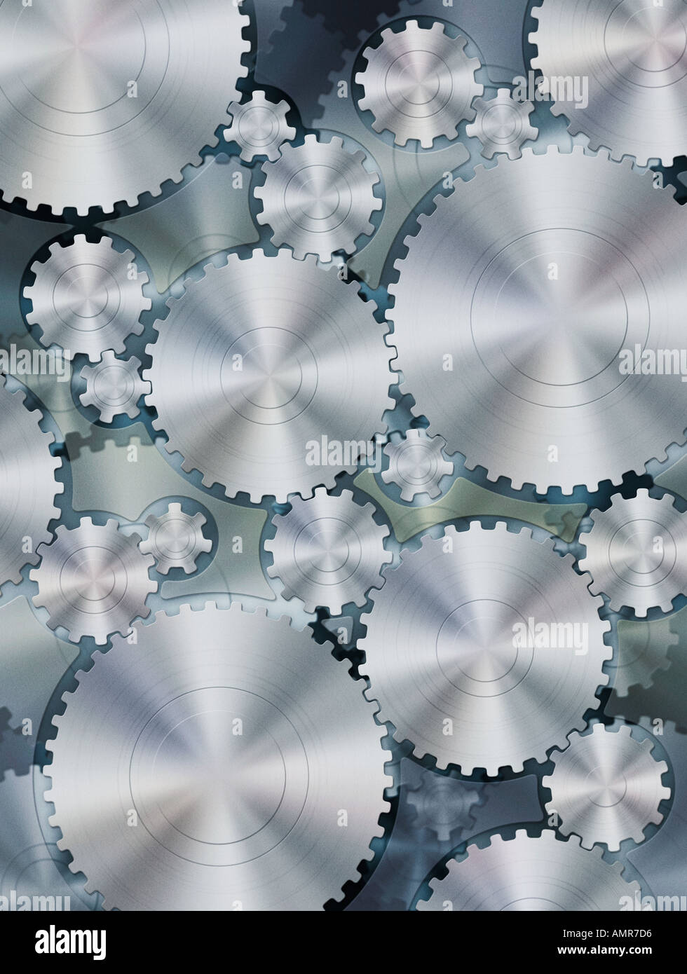 Metal cogs interlinked Stock Photo - Alamy