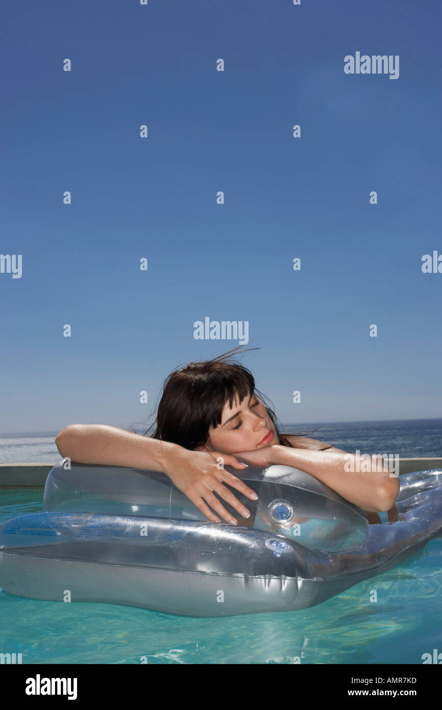 Woman Laying In Swimming Pool High Resolution Stock Photography and ...
