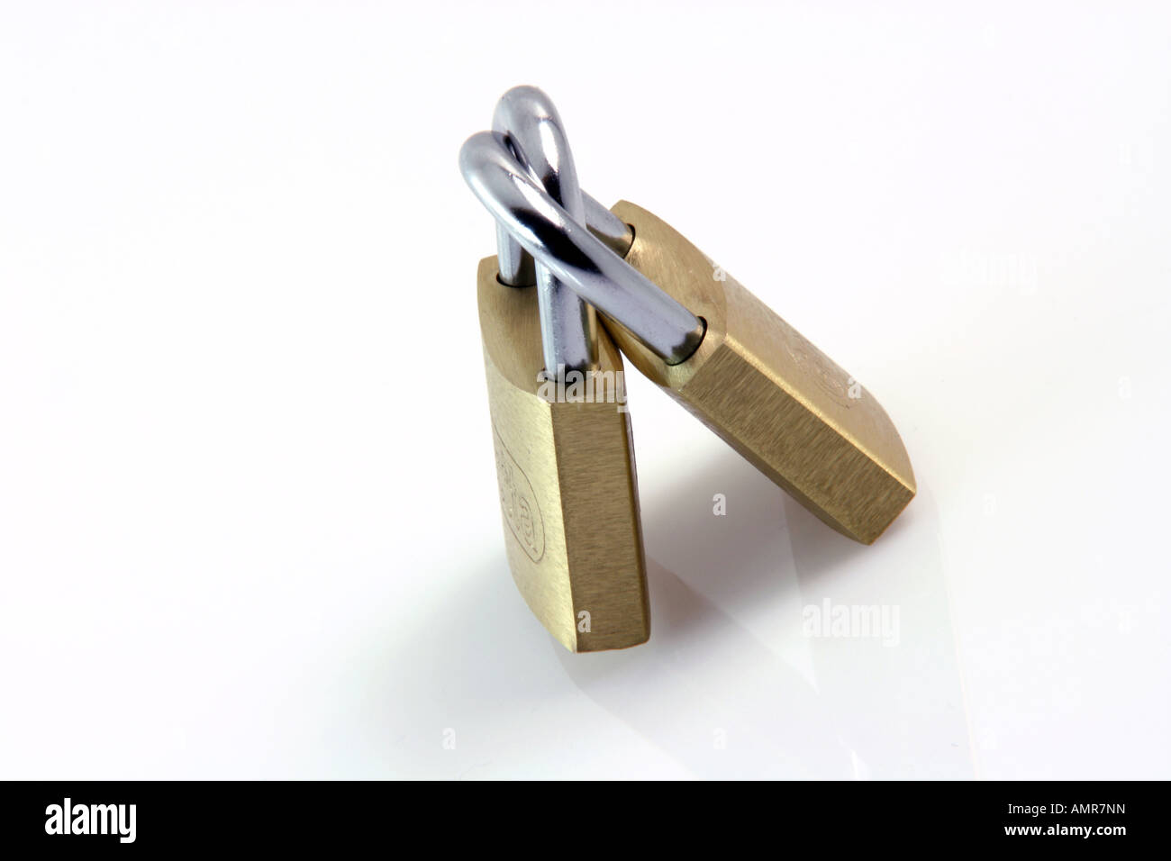 safety and security concepts two metalic padlocks locked each other ...