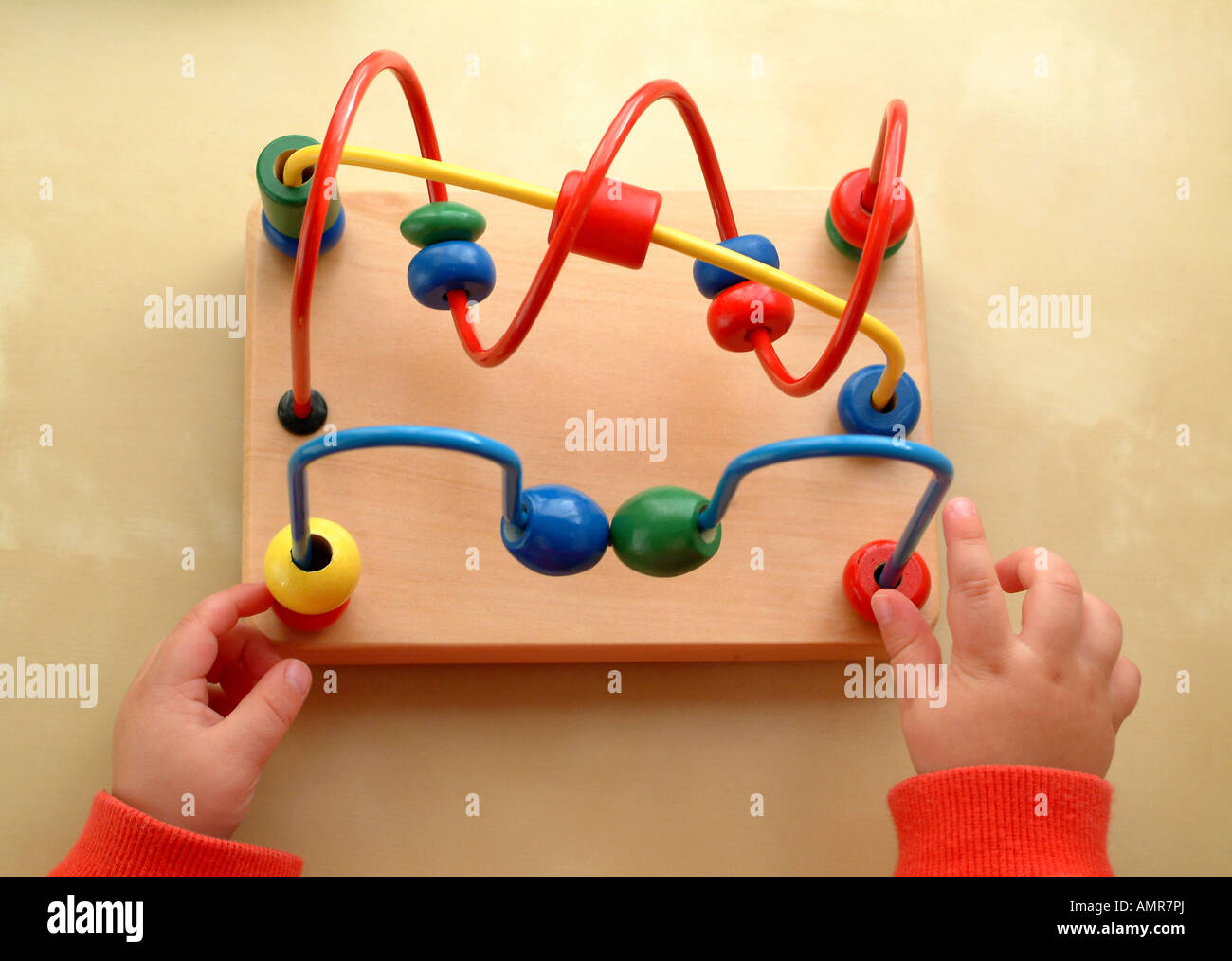 Child red green yellow blue toy bead hi-res stock photography and ...