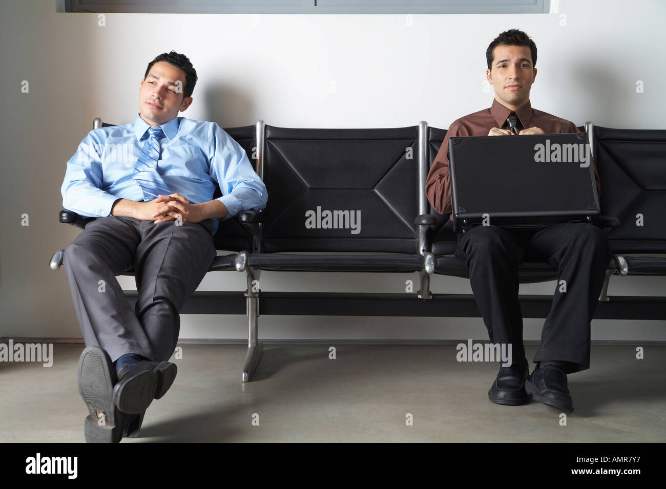 Businessmen in Waiting Area Stock Photo - Alamy