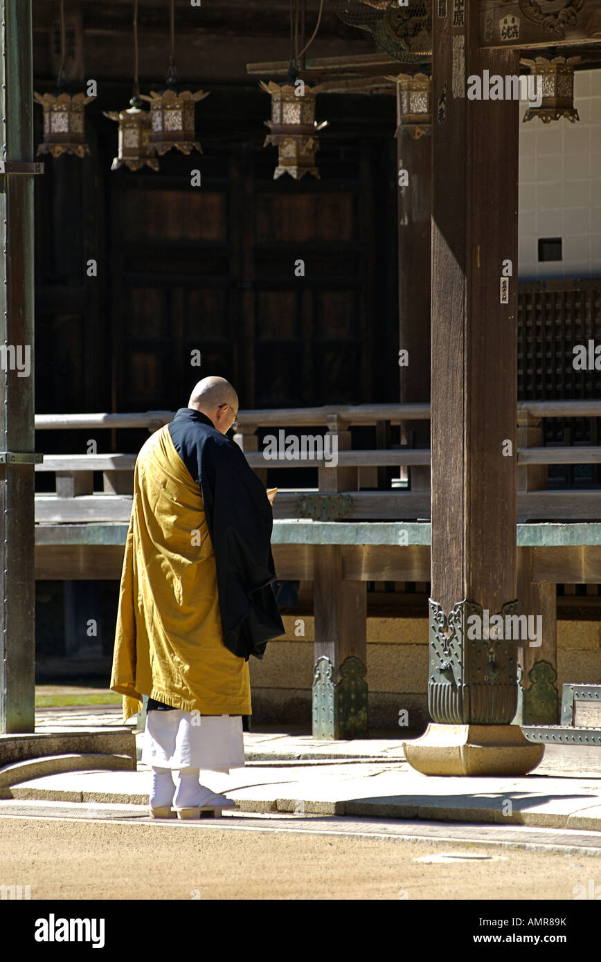 Japanese buddhist monk reading a prayer at the Danjo Garan complex ...