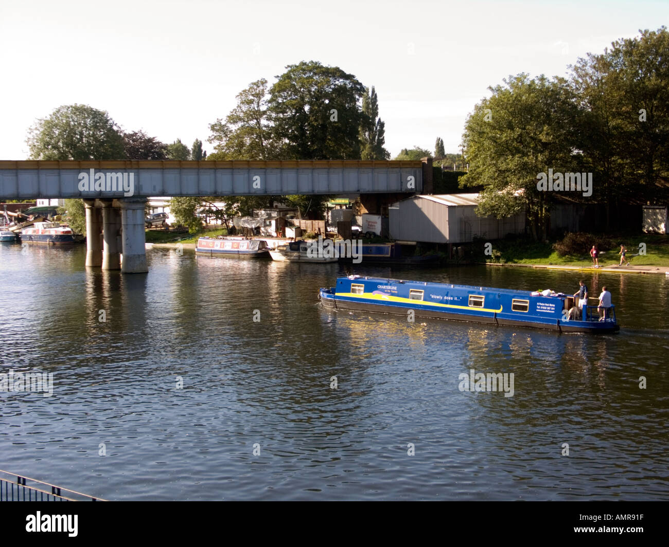 Narrowboat approaching Railway Bridge, River Thames, Staines, Middlesex ...