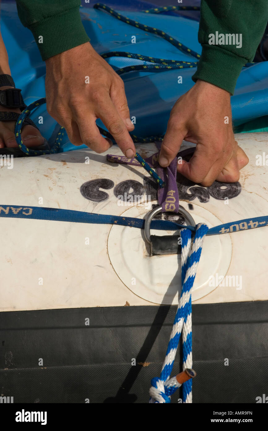 Detail of hands rigging a raft MR Stock Photo - Alamy