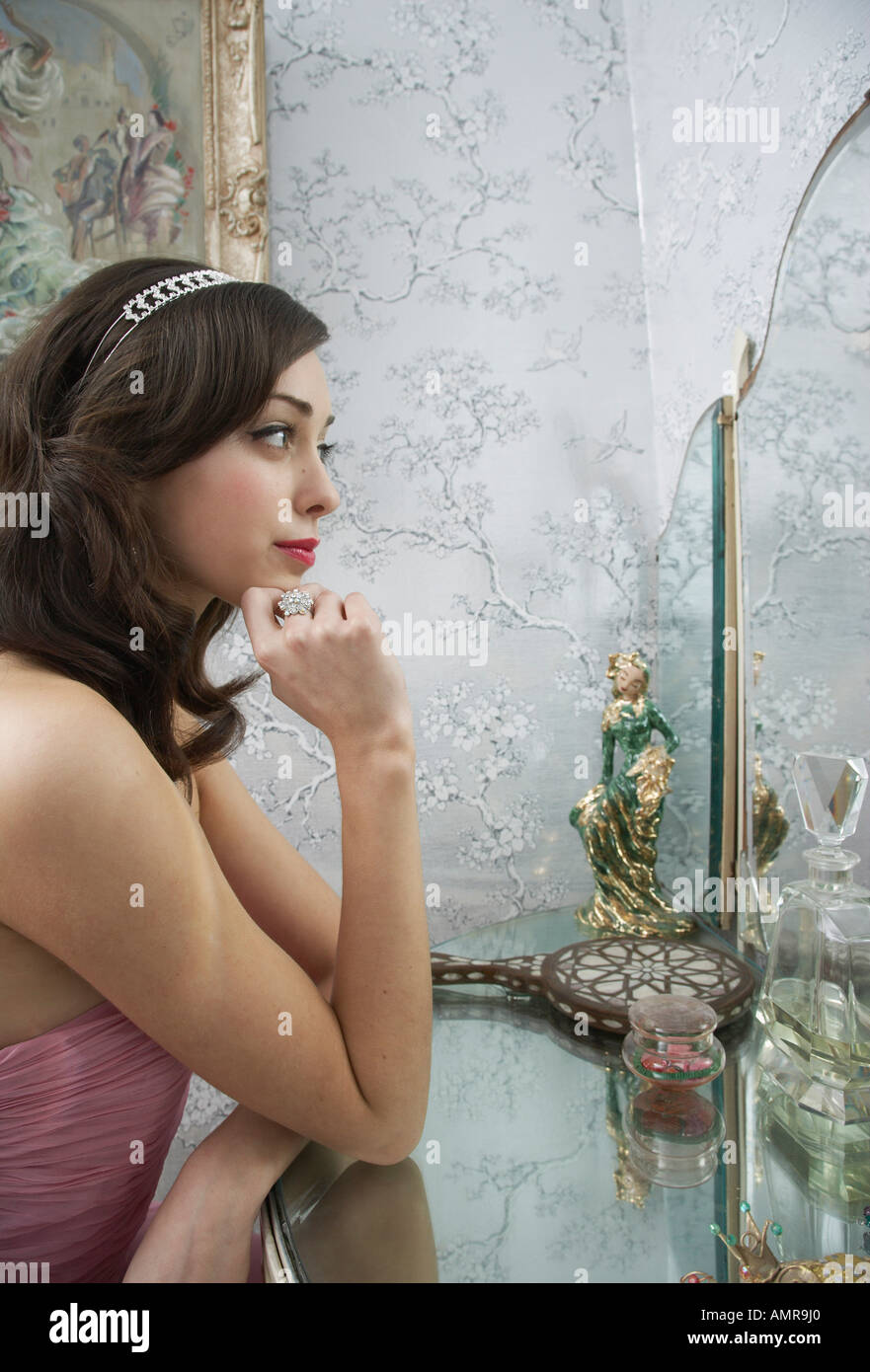Woman Looking in Mirror Stock Photo - Alamy